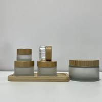 China 5g To 100g Frost Transparency Glass Cream Jar Wooden Lids Screw Mouth for sale
