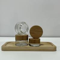 China 5g To 100g Frost Transparency Glass Cream Jar Wooden Lids Screw Mouth for sale