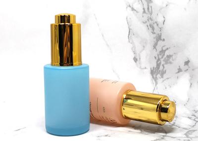 China Empty Custom Blue Frosted Push Button Serum Dropper Bottle With Lids for sale