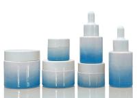 China Empty Custom Blue Frosted Push Button Serum Dropper Bottle With Lids for sale