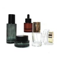 China Logo Silk Print Glass Cosmetic Bottles Flat Shoulder Empty Serum Bottle With Droppe for sale
