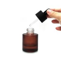 China High Durability Green Frosted Amber empty glass serum bottles Flat Shoulder for sale