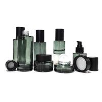 China High Durability Green Frosted Amber empty glass serum bottles Flat Shoulder for sale