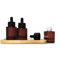 China Flat Shoulder Glass Serum Bottle Cosmetic Packaging Bottles Leakproof for sale