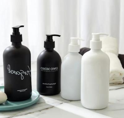 China Custom Printing 250ml 8oz Matte Black White Boston Round Empty Cosmetic Glass Shampoo Pump Lotion Bottle for sale