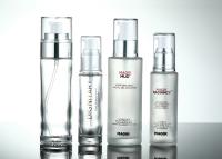 China 1 Oz Transparent Facial Serum Oil Empty Glass Lotion Bottle With Silver Pump Caps for sale