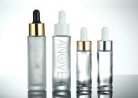 China 1 Oz Transparent Facial Serum Oil Empty Glass Lotion Bottle With Silver Pump Caps for sale