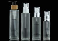 China 1 Oz Transparent Facial Serum Oil Empty Glass Lotion Bottle With Silver Pump Caps for sale