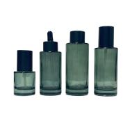 China Small Green Cosmetic Glass Lotion Bottles 40ml 50ml 100ml 150ml for sale