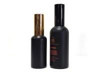 China Custom Color 1 Oz Empty Cosmetic Bottles Round Glass Packaging With Paper Box for sale