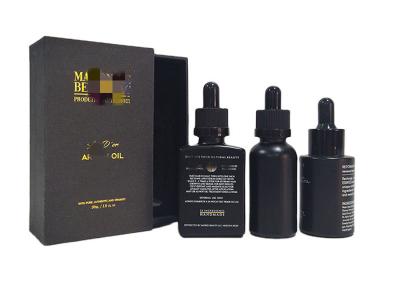 China Custom Color 1 Oz Empty Cosmetic Bottles Round Glass Packaging With Paper Box for sale