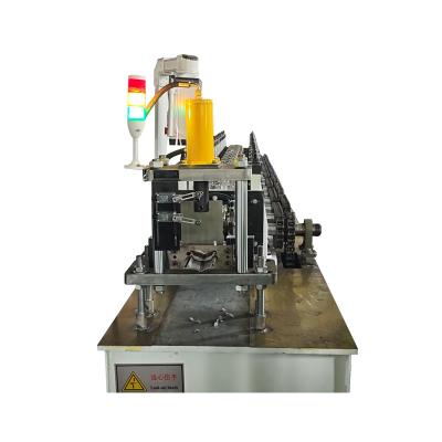 China Hydraulic Cutting Roller Shutter Door Steel Roll Forming Machine PLC for sale
