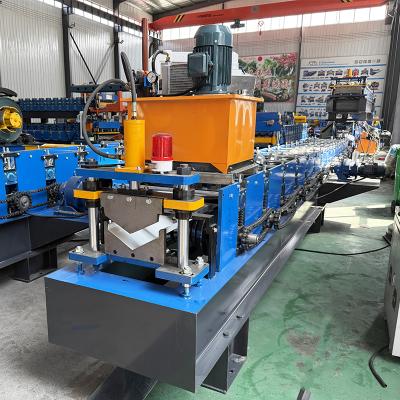 China Color Steel Tile Roof Ridge Cap Roll Forming Machine PLC Control Hydraulic Cutting Steel Profile for sale