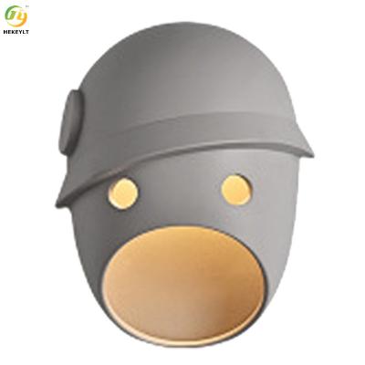 China Nordic creative mask wall lamp for homestay living room bedroom aisle for sale
