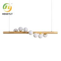 China Nordic Solid Wood Style Restaurant Lamp Simple Modern LED Creative Bar Chandelier for sale