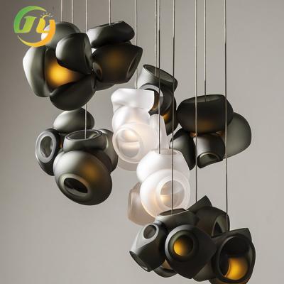 China Customized Modern Suspended Sphere Pendant Lights with Yellow Glow-Perfect for Future Villa Hotel Hall Staircase for sale