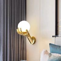China Creative Personality Gold Wall Lamp Nordic Modern Living Room Bedroom Decorative Wall Lamp for sale
