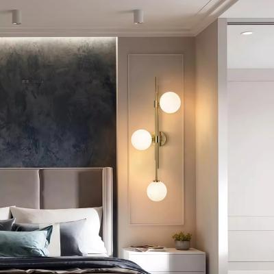 China Modern Minimalist Brass 3-Glass Globe Wall Sconce, Modern Adjustable Wall Light for Home Decor for sale