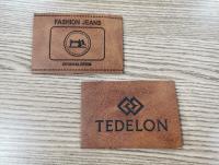 China Embossed Logo PU Leather Patches Custom Color Sew On Clothing for sale