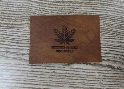 China Sew On Clothing PU Leather Patches Garment Labels Embossed Logo for sale