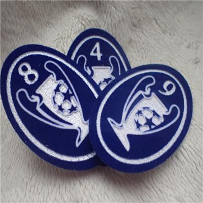 China Oval Shape Personalised Embroidered Patches Ball Uniform Plush Monochrome Flocking Heat Transfer for sale