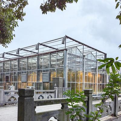 China Steel Flame Multi Span Greenhouse Commercial Glass Greenhouse With Winter Cover And Hydroponic System for sale