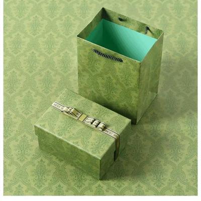 China Green Embossing Cardboard Cosmetic Packaging Box With Ribbon for sale