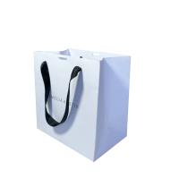 China 350gsm Luxury Simple Paper Handbag White Paper Gift Bags With Handles for sale