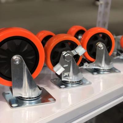 China Orange Double Ball Bearing Castor Wheel 100mm with Side Brake Zinc Coated for sale
