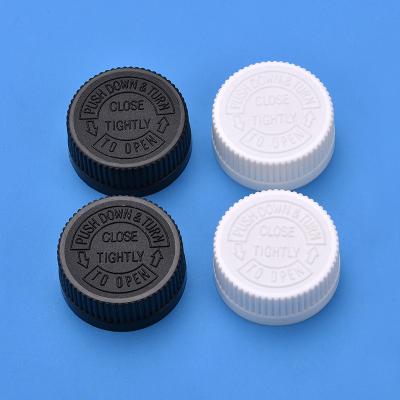 China Ribbed Closure 32mm Child Resistant Cap For Pill Bottle for sale