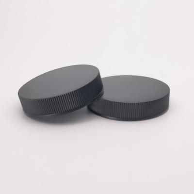China 47MM Black Ribbed Plastic Jar Lid 47/400 PP Plastic Bottle Cap for sale