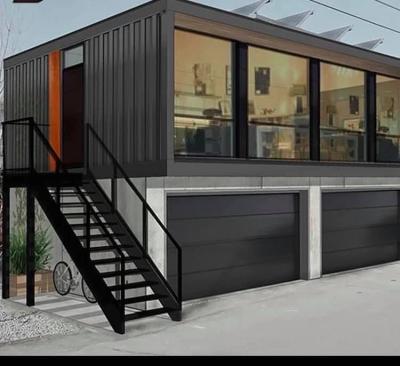 China 2 Floors Steel Prefab House Family Living With Parking Lot Glass Door for sale