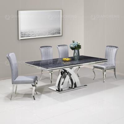 China UK Style 0.57cbm Grey Marble Dining Table Stainless Steel Cross Leg for sale