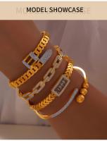 China Geometric Hollow Diamond Inlay Paved Zircon Bangles Titanium Steel Gold Plated Bracelet Z051 for sale