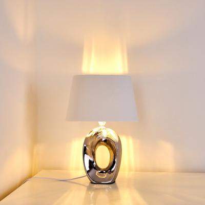 China Modern Silver Ceramic Table Lamp with White Fabric Shade for sale