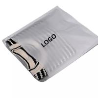 China Custom Logo Waterproof Clothing Stamped Glassine Paper Bag White Packing Pouch Envelope for sale