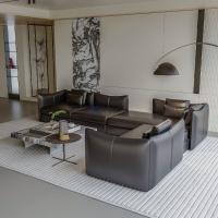 China Modular Modern Italian Minimalist Black Leather Sofa with Down-Filled Cushions and Corner Configuration for Large Living Spaces for sale
