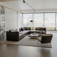 China Modular Modern Italian Minimalist Black Leather Sofa with Down-Filled Cushions and Corner Configuration for Large Living Spaces for sale