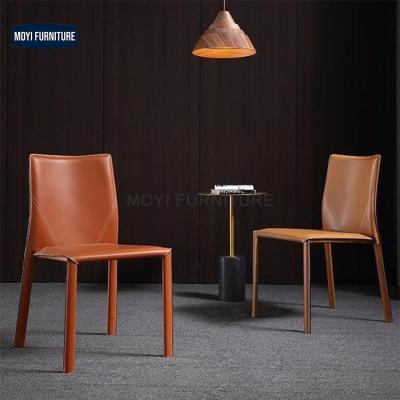 China Dining Chair Crafted with Modern Metal Frame and Genuine Saddle Leather Upholstery Stylish Relax Seating Dining Room for sale