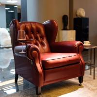 China Sponge Filled Vintage Designer Genuine Leather Arm Luxury Lounge Chair Single Sofa Luxury Accent Cigar Living Room Chairs for sale