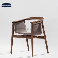 China Dining Room Furniture Italian Solid Wood Armchair Modern Curved Backrest Dining Chair With Saddle Leather Seat for sale