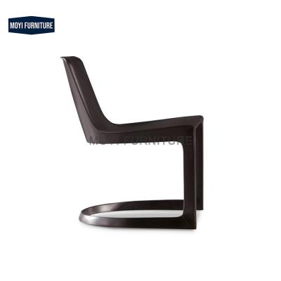 China Modern New Design Leather Dining Chair Hotel Villa Black Metal Frame S Shape Restaurant Armchair Furniture for sale