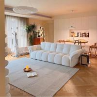 China Lily Sofa Cream Style Modern Minimalist Designer Petal Light French Straight Row Living Room Fabric Sofa for sale