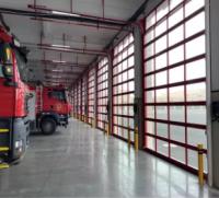 China Intelligent servo high speed Industrial Automatic Transparent Aluminum Sectional Door Glass Bifold Adjusted Height 550mm for sale