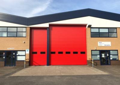 China Polyurethane Foam Insulated Sectional Doors Powder Coated With Hinges for sale