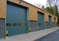China Powder Coated Steel Insulated Sectional Doors With Vinyl Or Brush Weatherstripping for sale