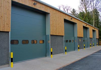 China Powder Coated Steel Insulated Sectional Doors With Vinyl Or Brush Weatherstripping for sale