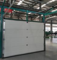 China Flat Or Contoured Panel Insulated Sectional Doors Industrial Warehouse Overhead Vertical Lifting for sale