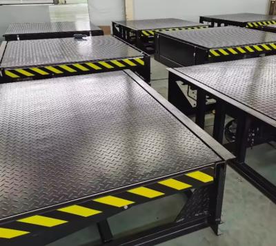 China Customizable Powder Coated/Galvanized Loading Dock Leveler with Safety Chains and Handheld Remote Controls for sale
