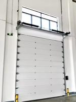 China Steel Insulated Overhead Sectional Door with Security Lock Wind Resistant Design and Noise Reducing for sale